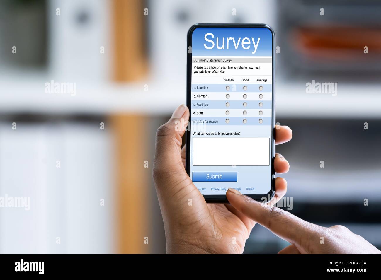 African Woman Filling Survey Poll Or Form On Mobile Phone Stock Photo ...