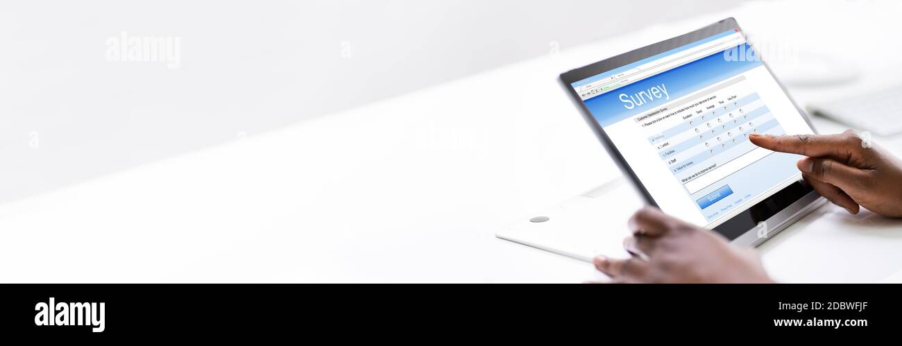 African Woman Filling Survey Poll Or Form On Laptop Computer Stock ...