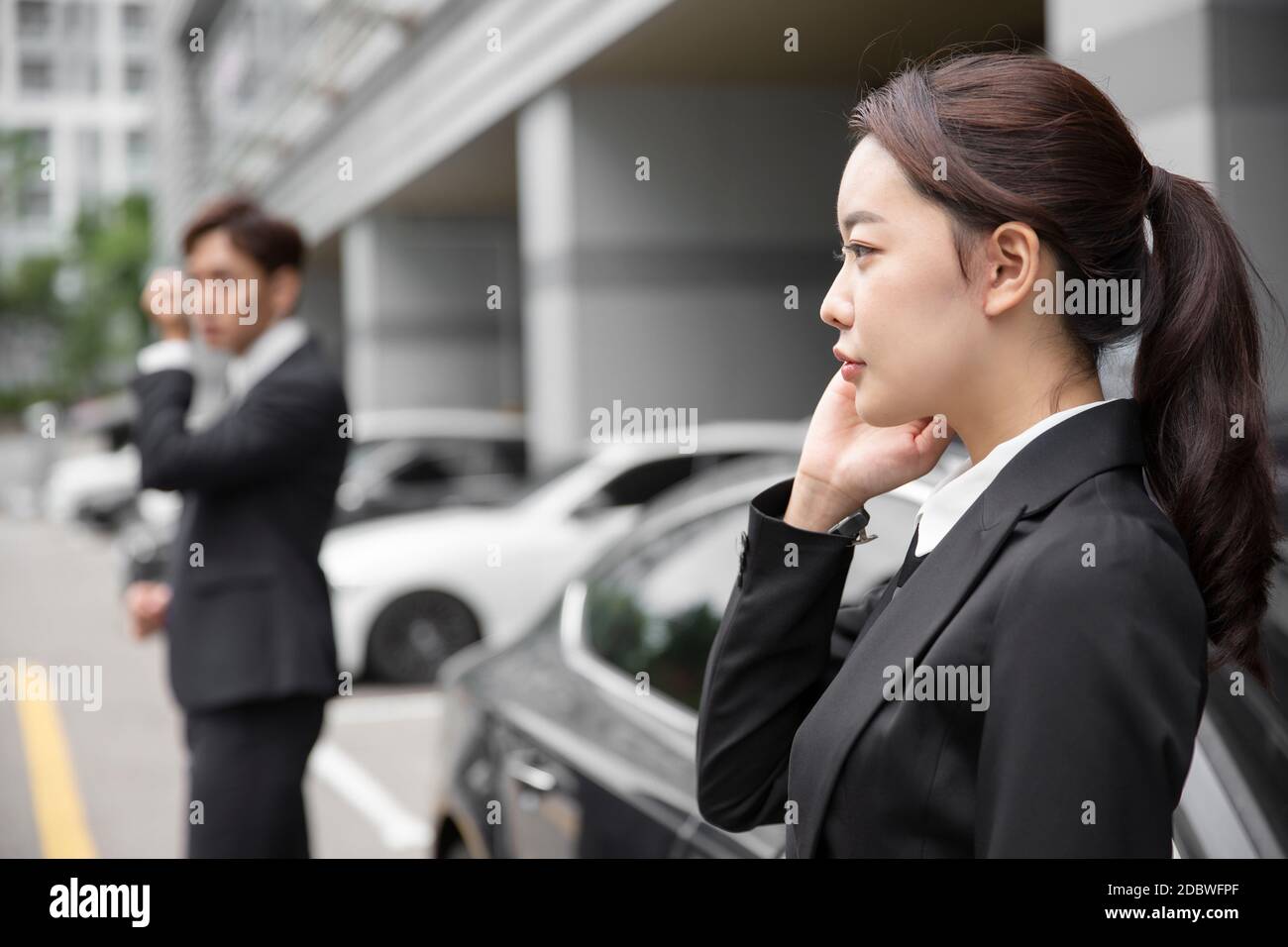 Asian male and female two security guards 047 Stock Photo - Alamy