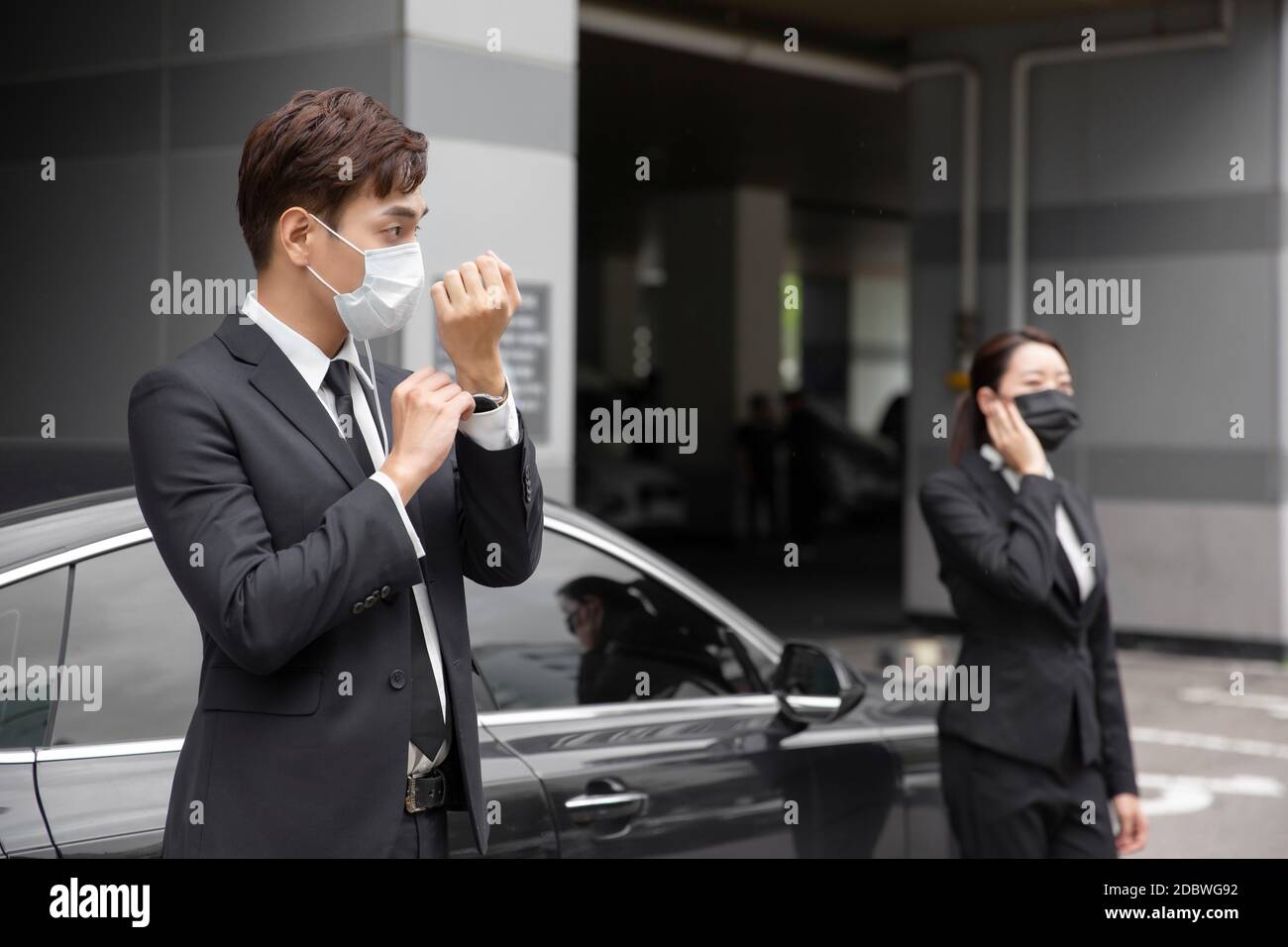 Asian male and female two security guards 050 Stock Photo - Alamy