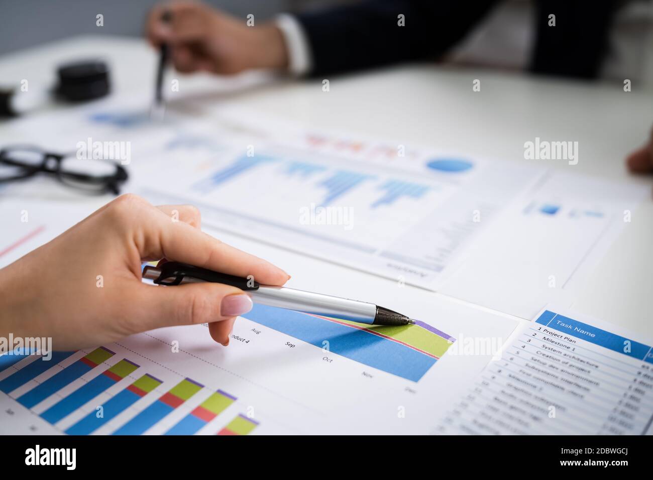 Financial Advisor Looking At Growth Progress Chart Or Graph Stock Photo ...