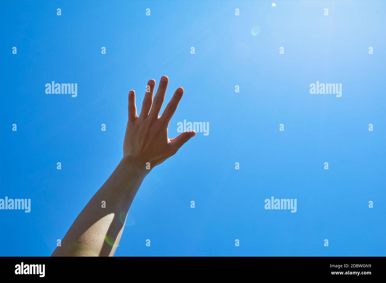 Raised Hand To The Sky Stock Photo - Alamy