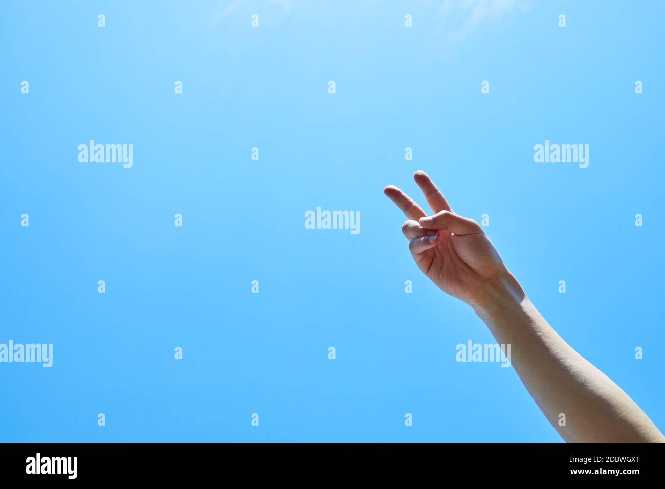 Raised Hand To The Sky Stock Photo - Alamy