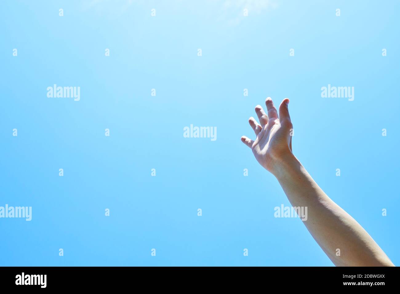 Raised Hand To The Sky Stock Photo - Alamy