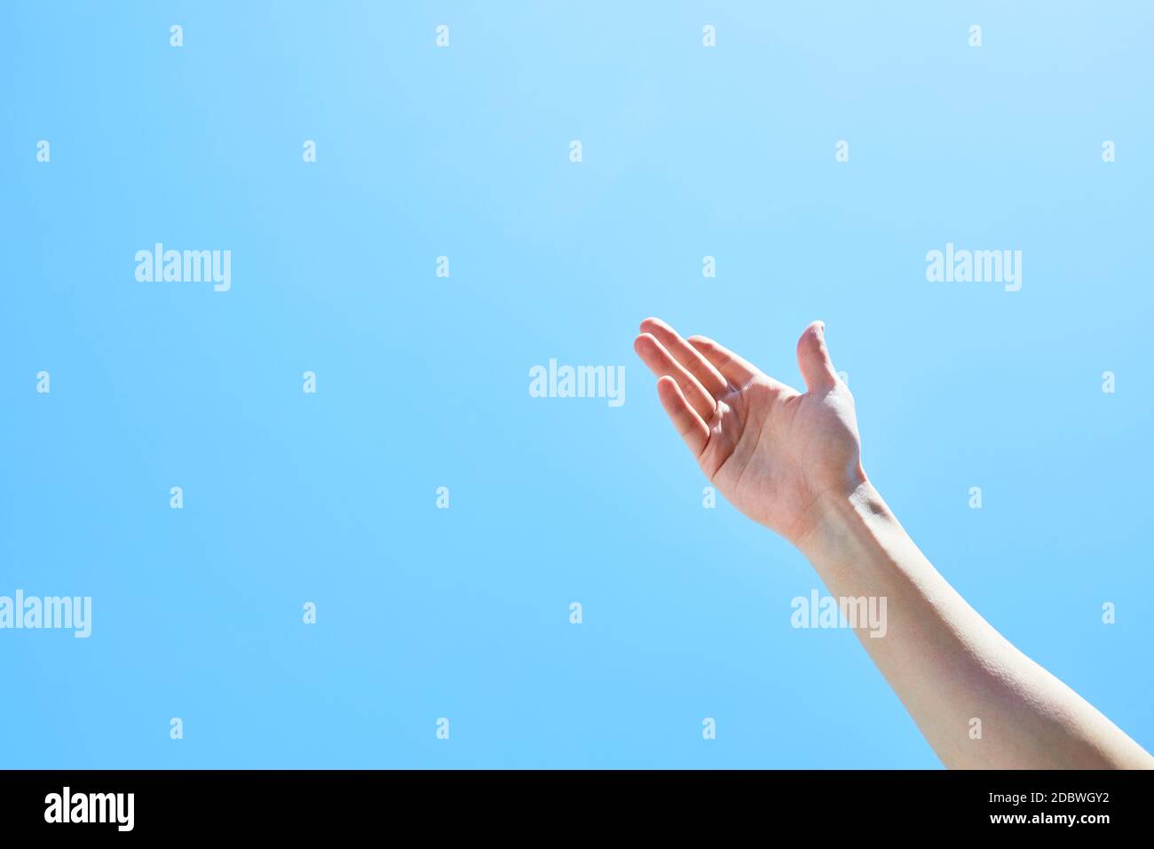 Raised Hand To The Sky Stock Photo - Alamy