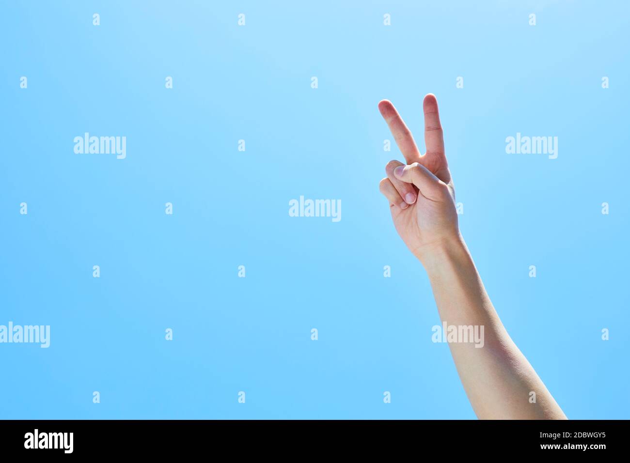 Raised Hand To The Sky Stock Photo - Alamy