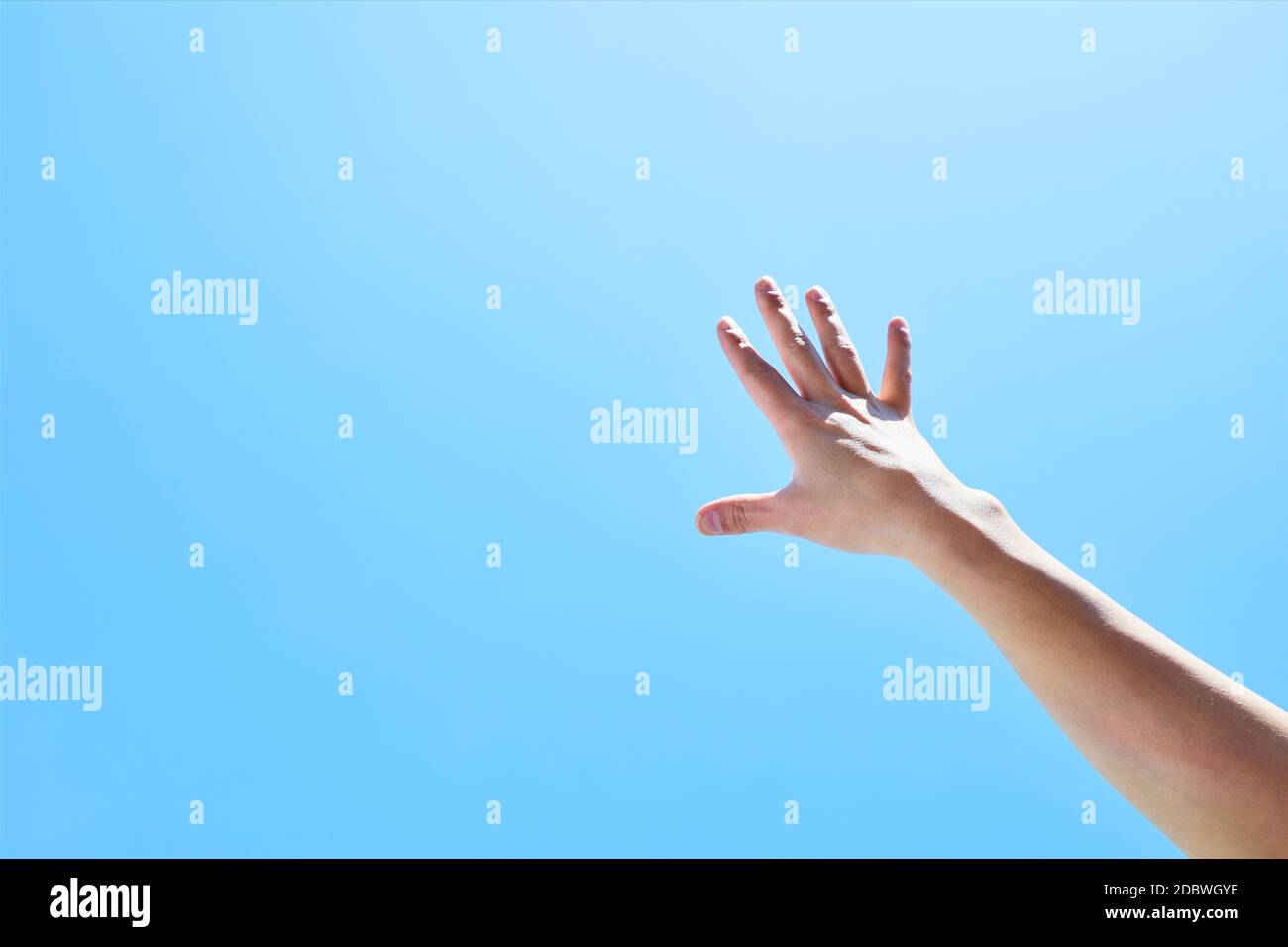 Raised Hand To The Sky Stock Photo - Alamy