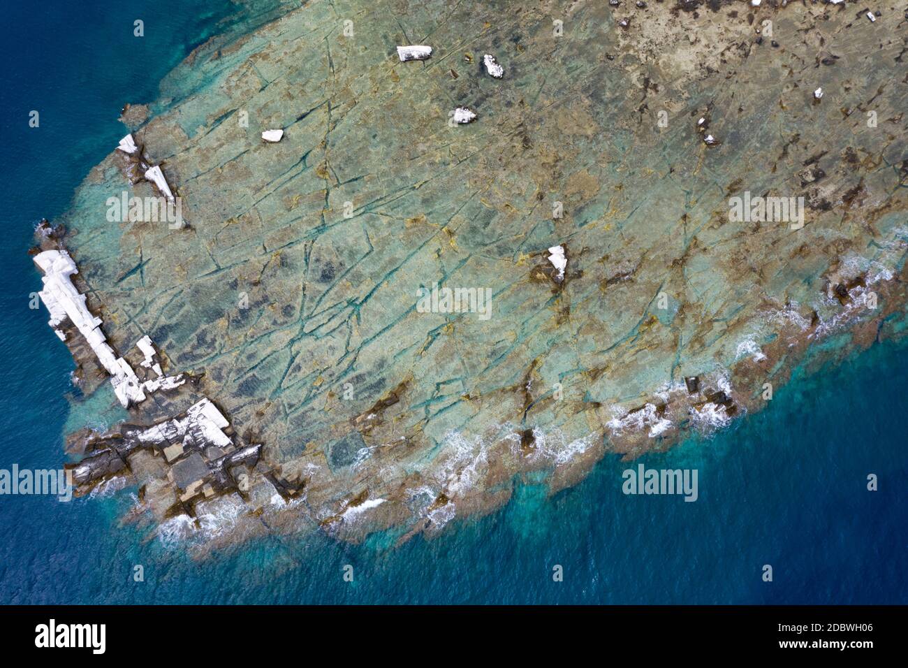 Aerial view of waves, rocks and transparent sea in Greece. Abstract ...