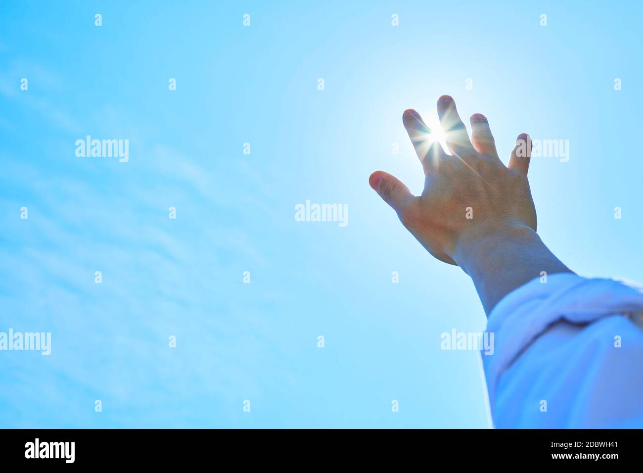 Raised Hand To The Sky Stock Photo - Alamy