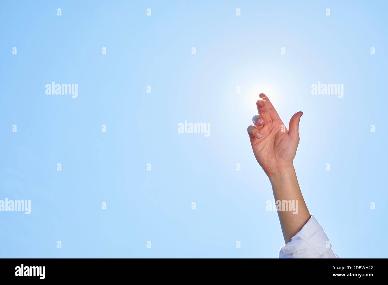 Raised Hand To The Sky Stock Photo - Alamy