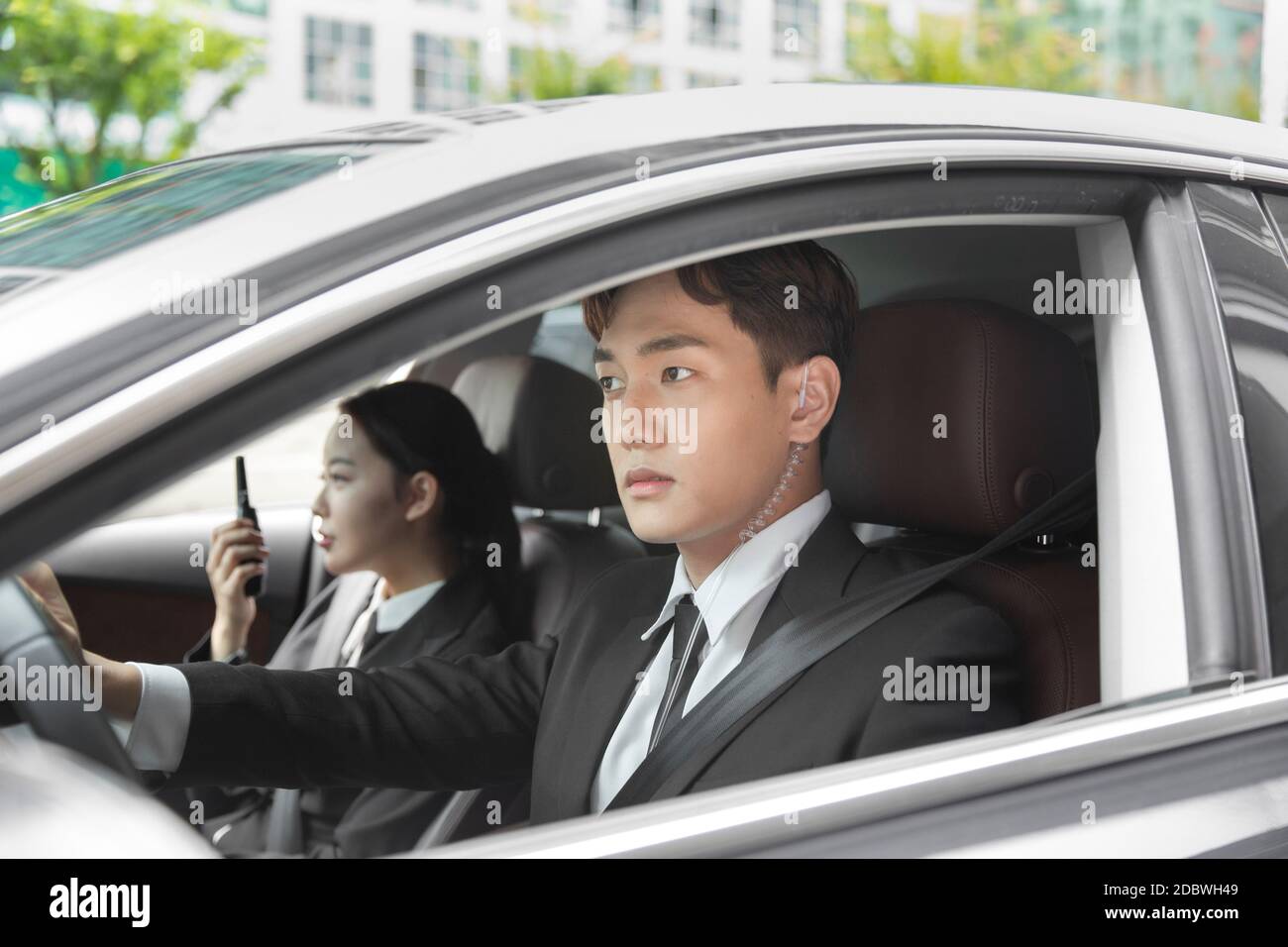 Asian male and female two security guards 055 Stock Photo - Alamy