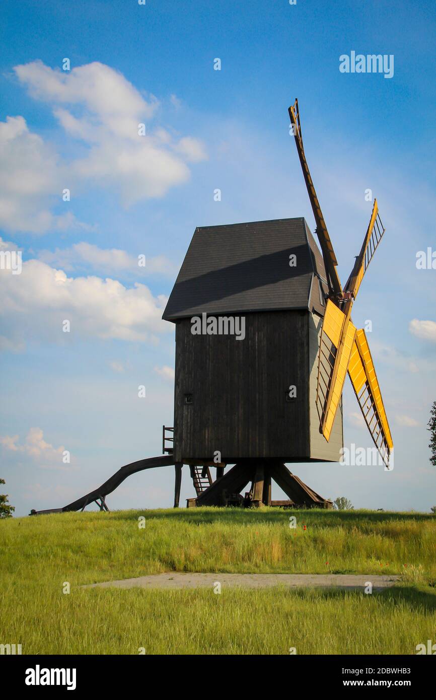 View of a well-preserved old post mill Stock Photo - Alamy