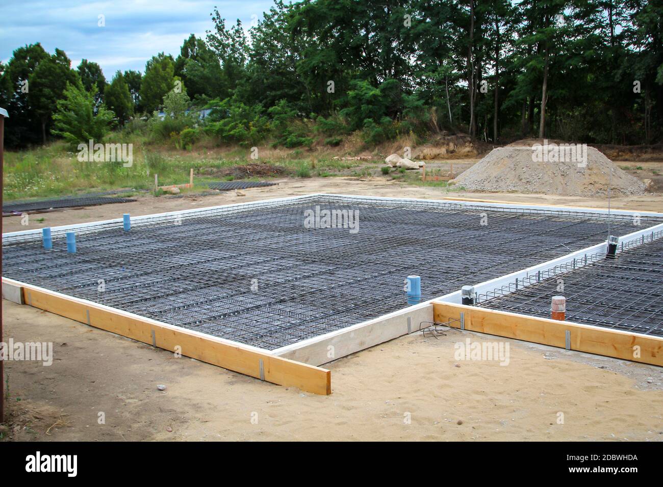 A base plate prepared for casting with steel reinforcement. The first ...