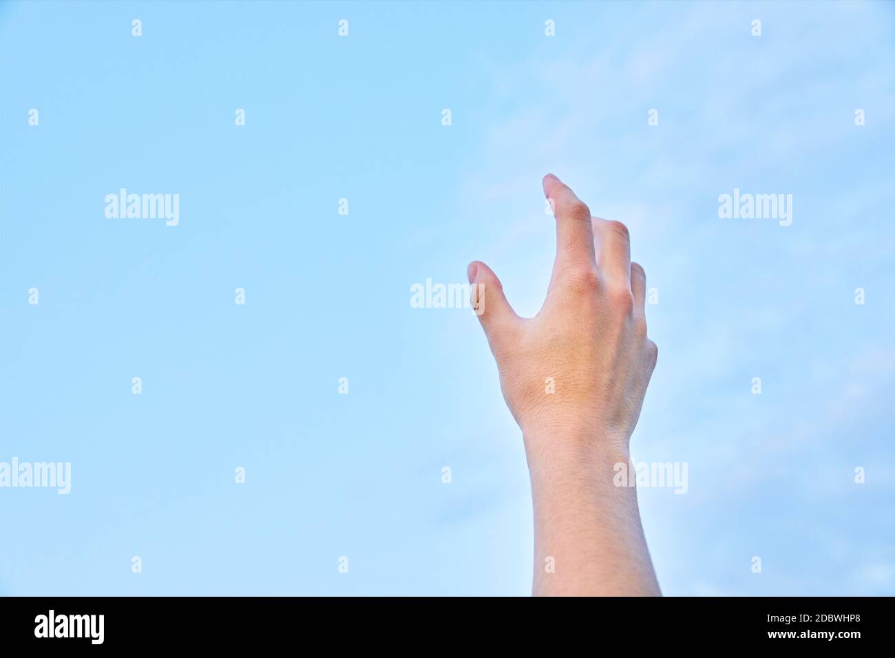 Raised Hand To The Sky Stock Photo - Alamy