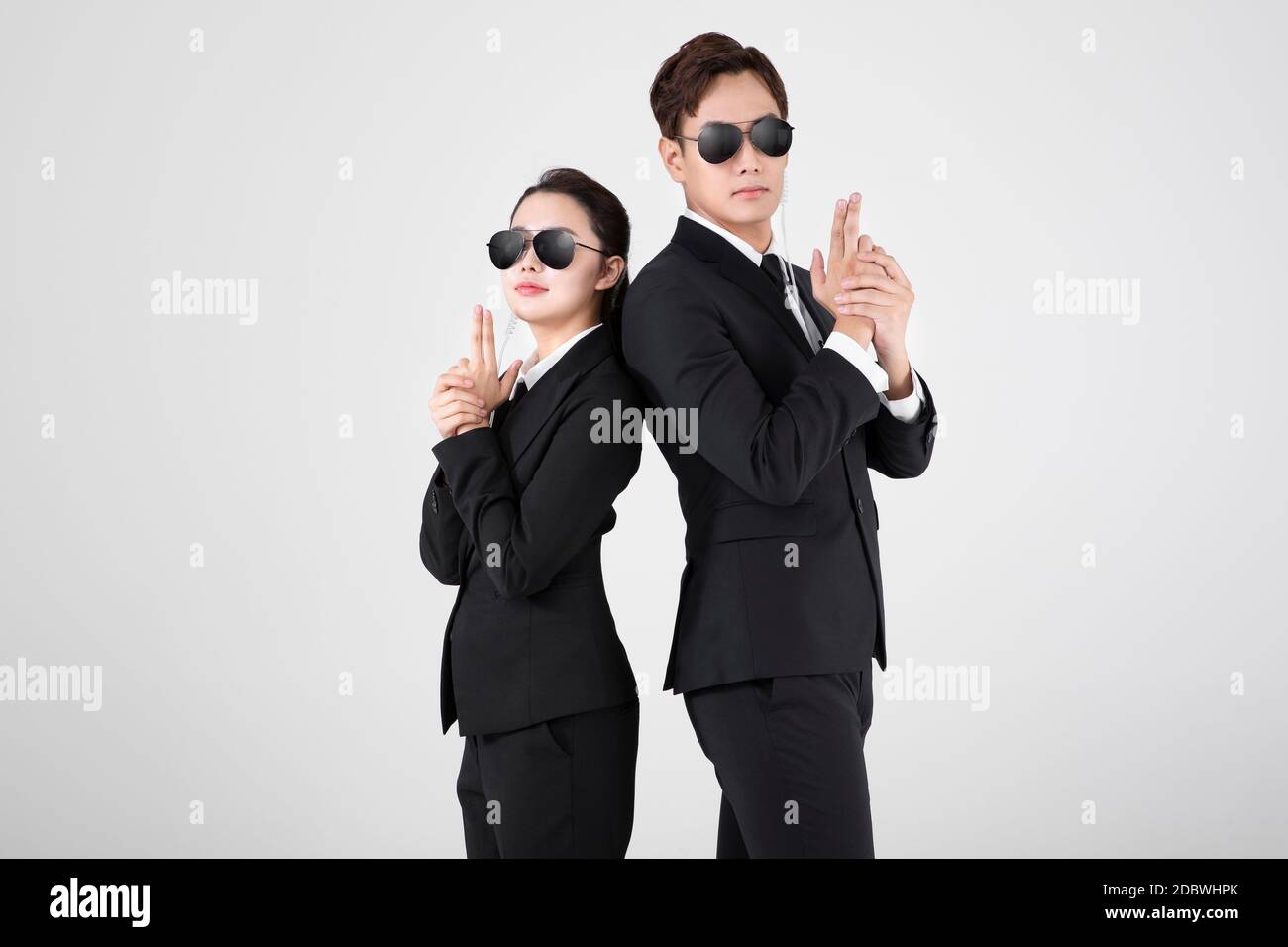 Asian male and female two security guards 059 Stock Photo - Alamy