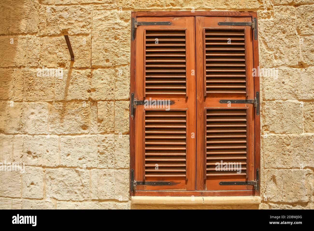 A shuttered window of a historic building with shutters Stock Photo - Alamy
