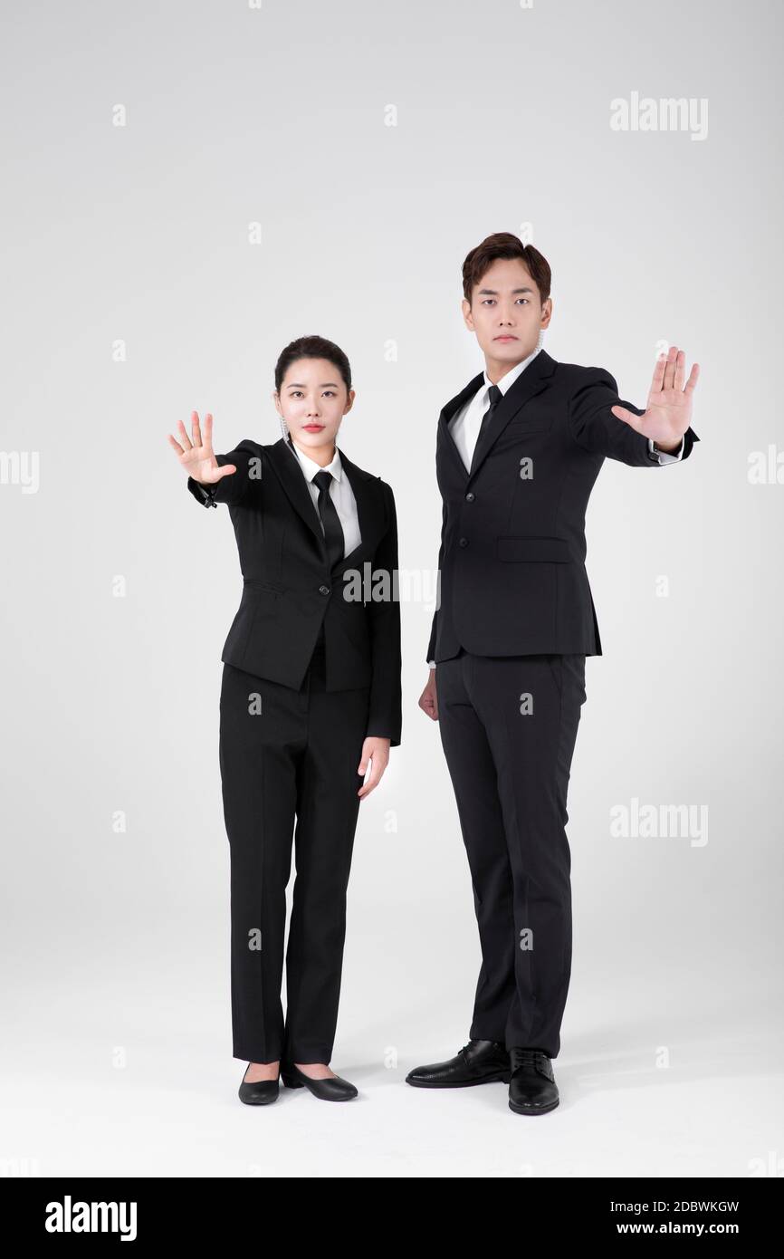 Asian male and female two security guards 067 Stock Photo - Alamy