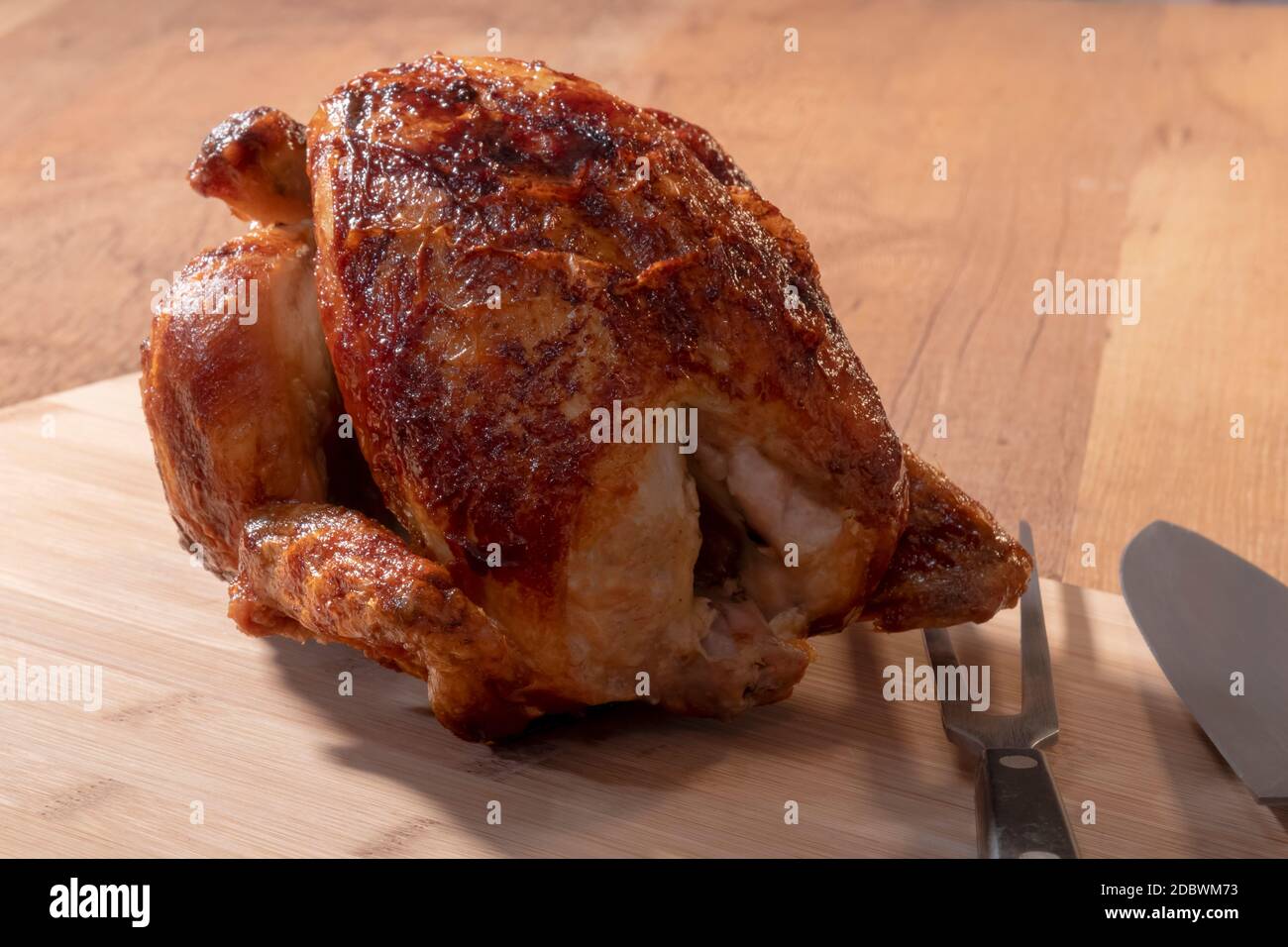 Selective focus and close up of a tempting rotisserie chicken with a ...
