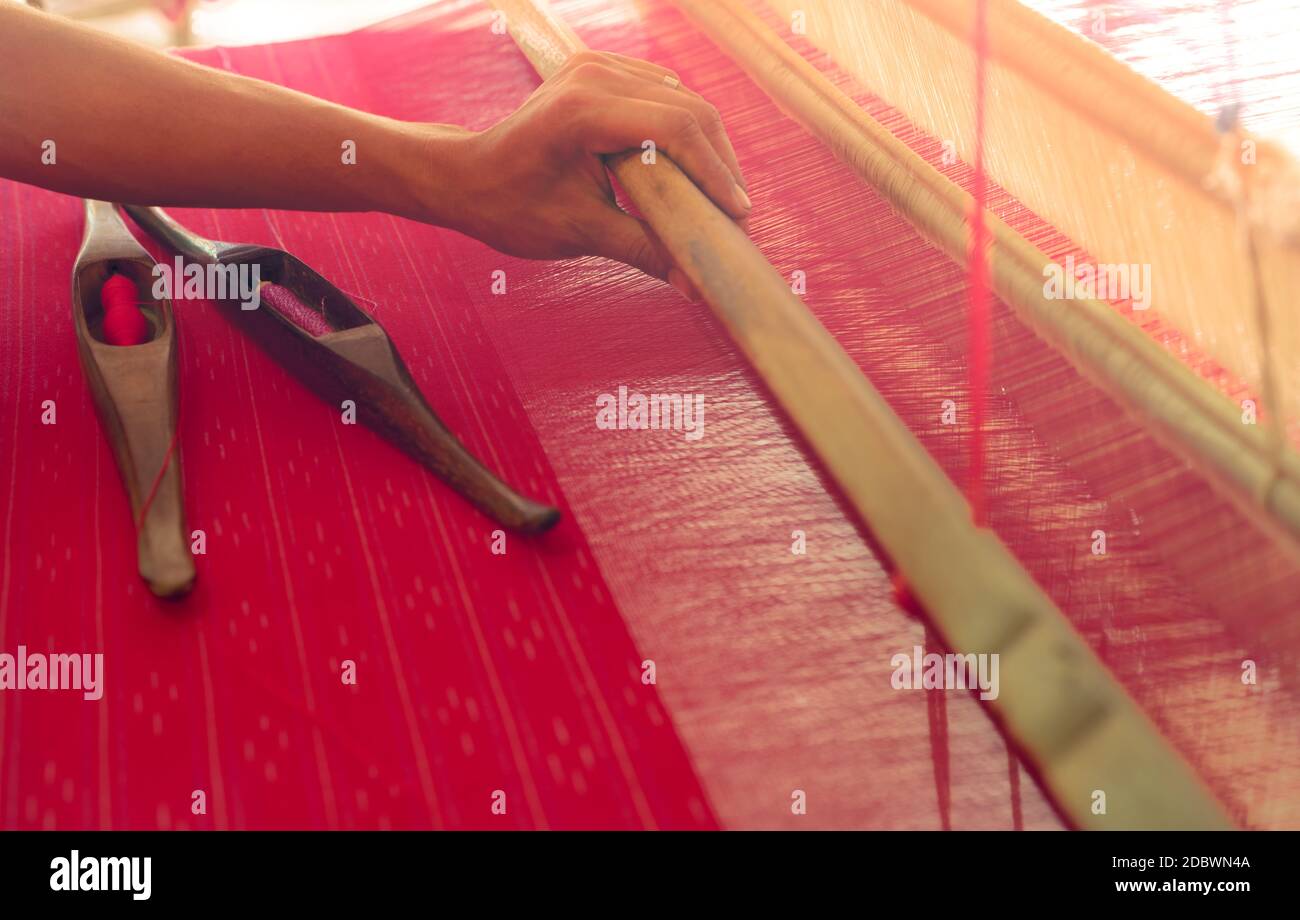 Woman working on weaving machine for weave handmade fabric. Textile ...
