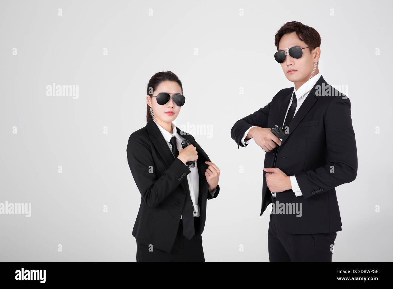 Asian male and female two security guards 079 Stock Photo - Alamy