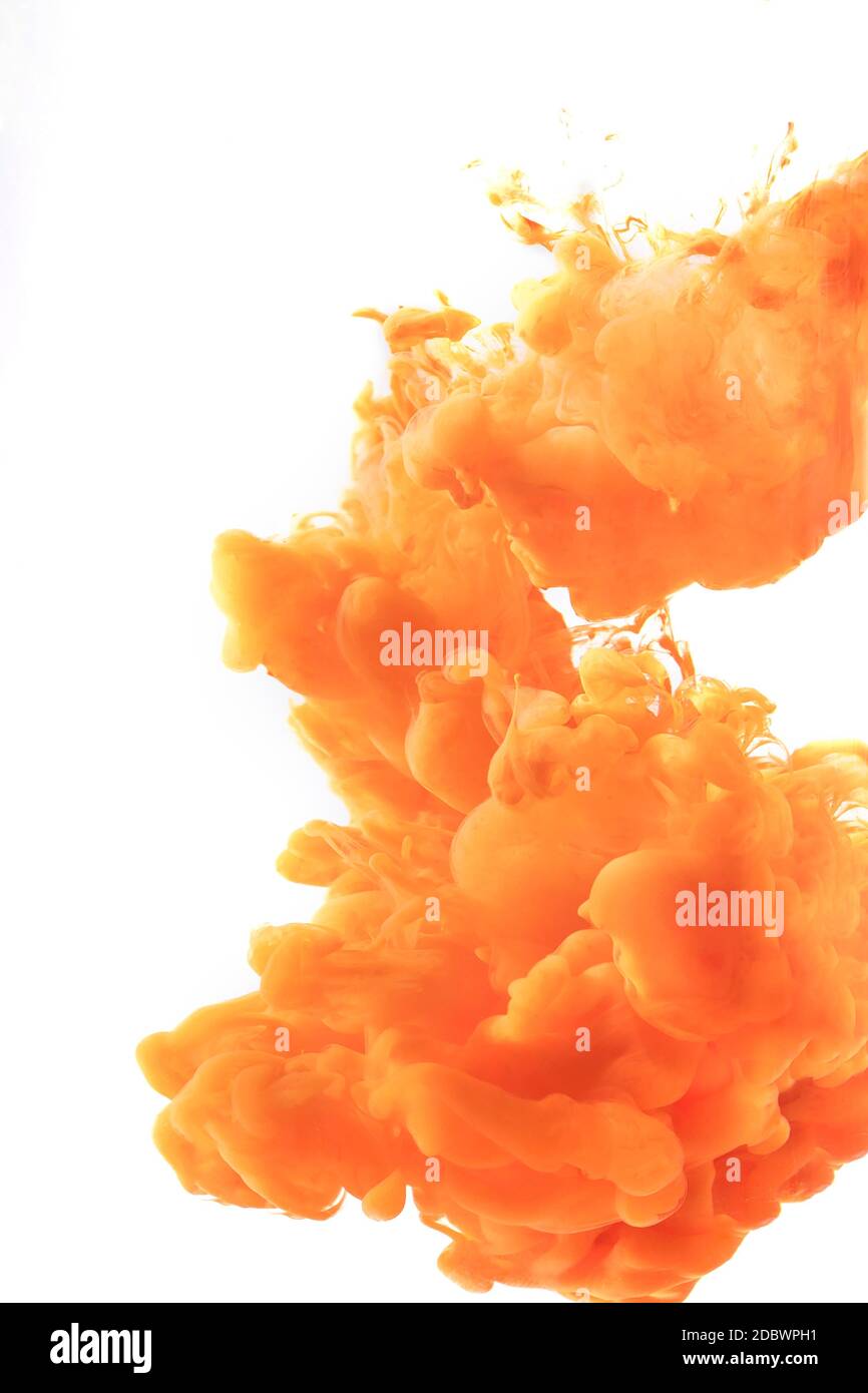 orange ink droplet issolated on white background Stock Photo - Alamy