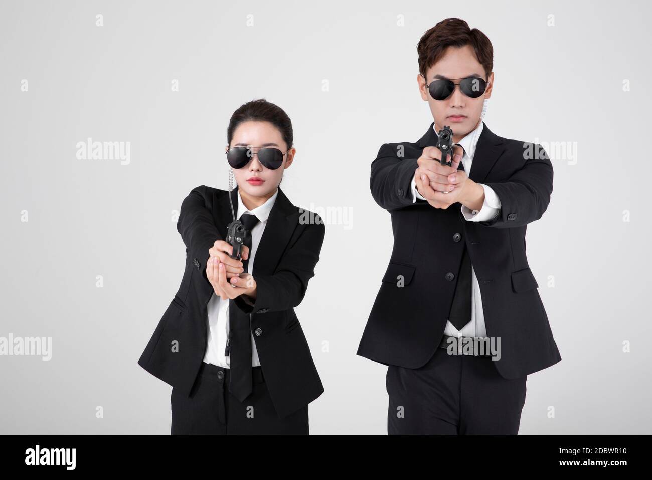 Asian male and female two security guards 082 Stock Photo - Alamy