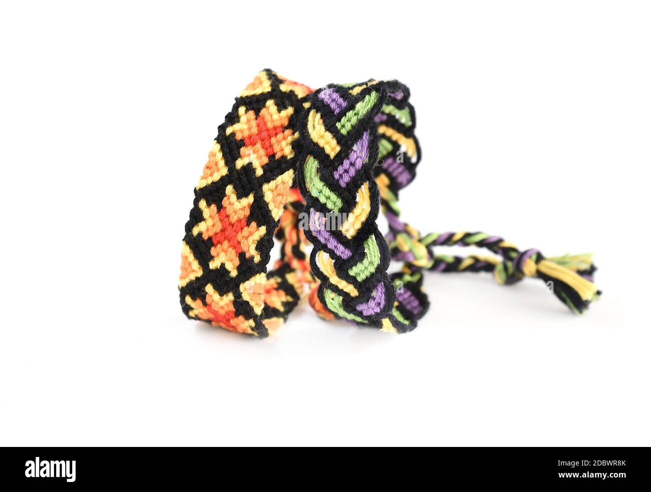 Selective focus of multi-colored woven DIY friendship bracelets ...