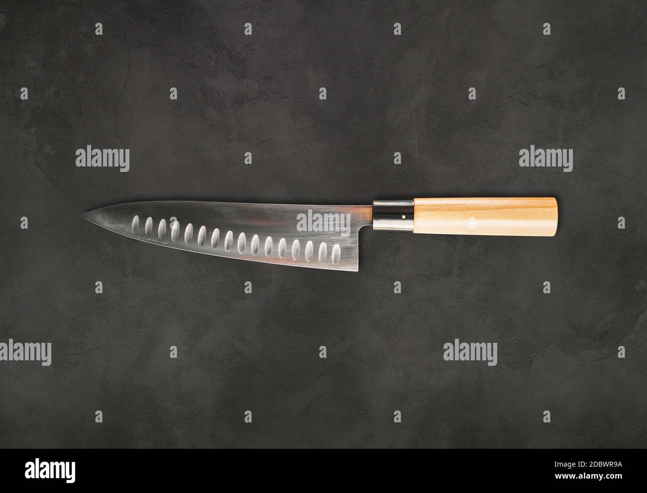 Traditional Japanese gyuto chief knife on concrete table background ...