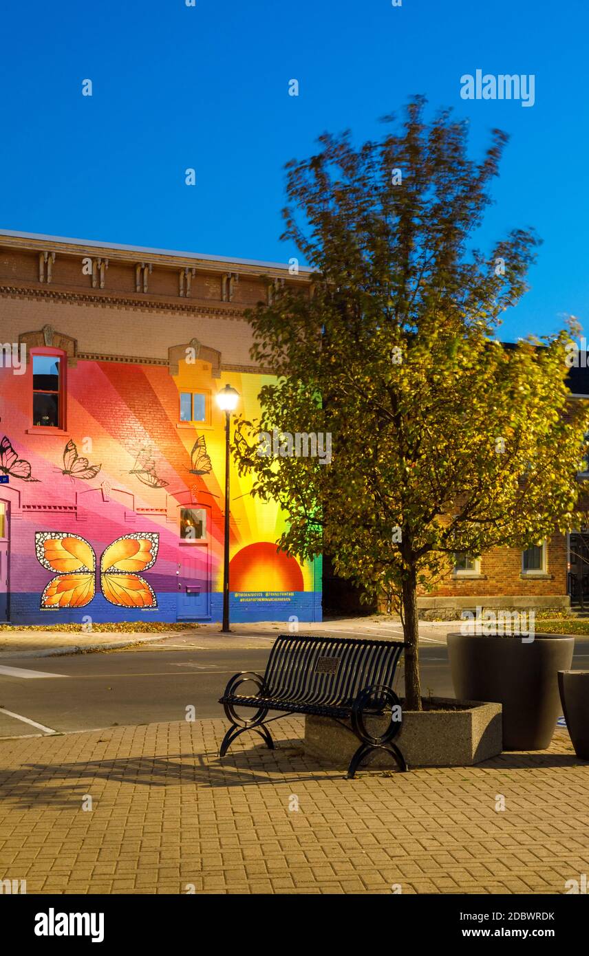 A colourful mural at Courthouse Square at dusk in Downtown Goderich ...