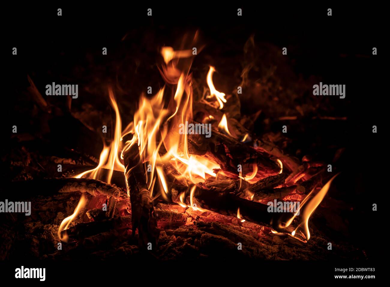 Bright burning fire with embers in front of black background Stock ...