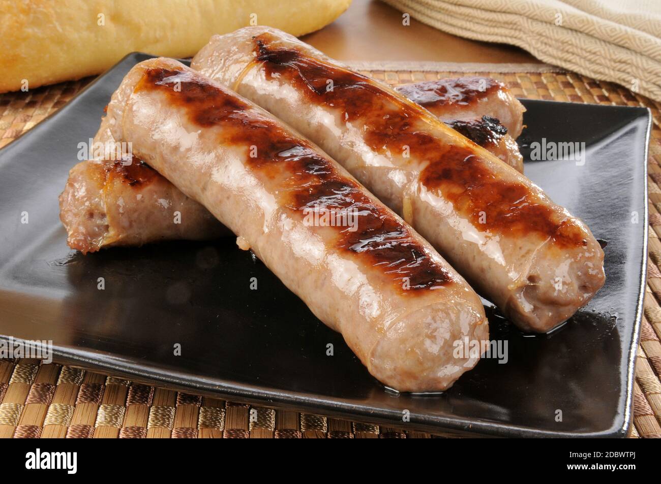 A plate of grilled bratwurst or sausages Stock Photo - Alamy