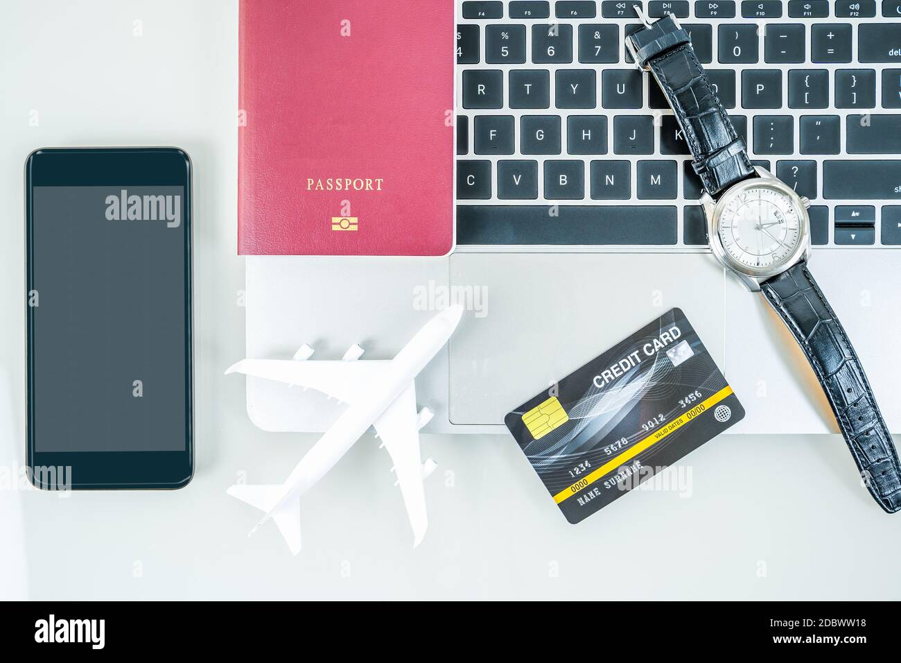 Smart phone, passport, credit card,wacth on keyboard, Traveling concept ...