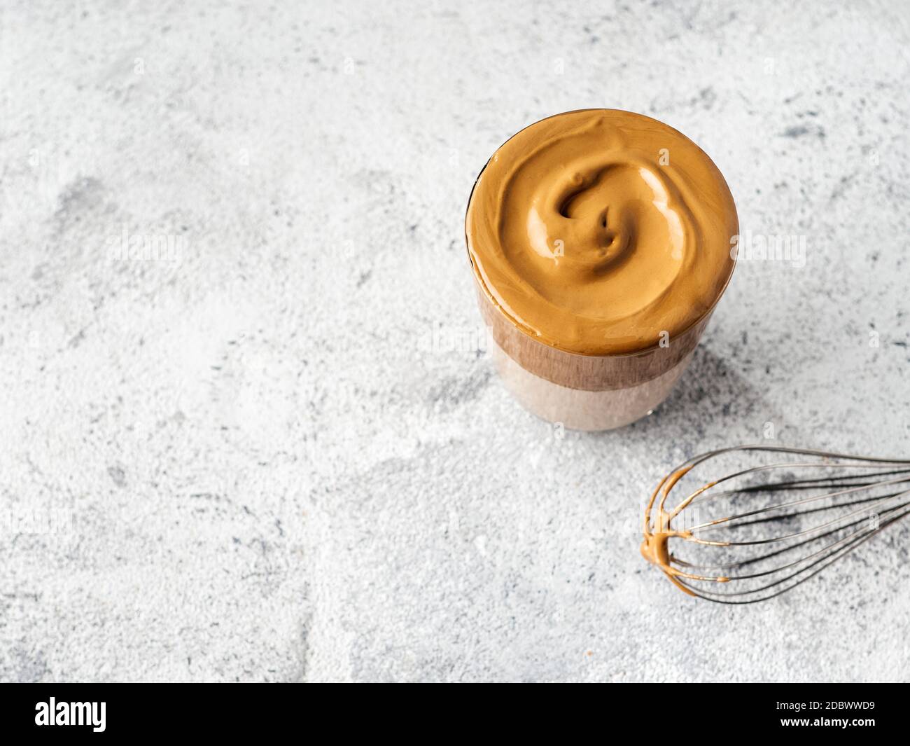 Trendy korean drink - dalgona coffee. Glass jar with cold or hot ...