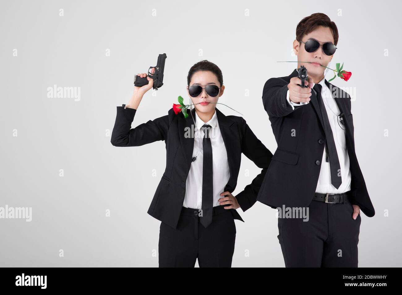 Asian male and female two security guards 092 Stock Photo - Alamy