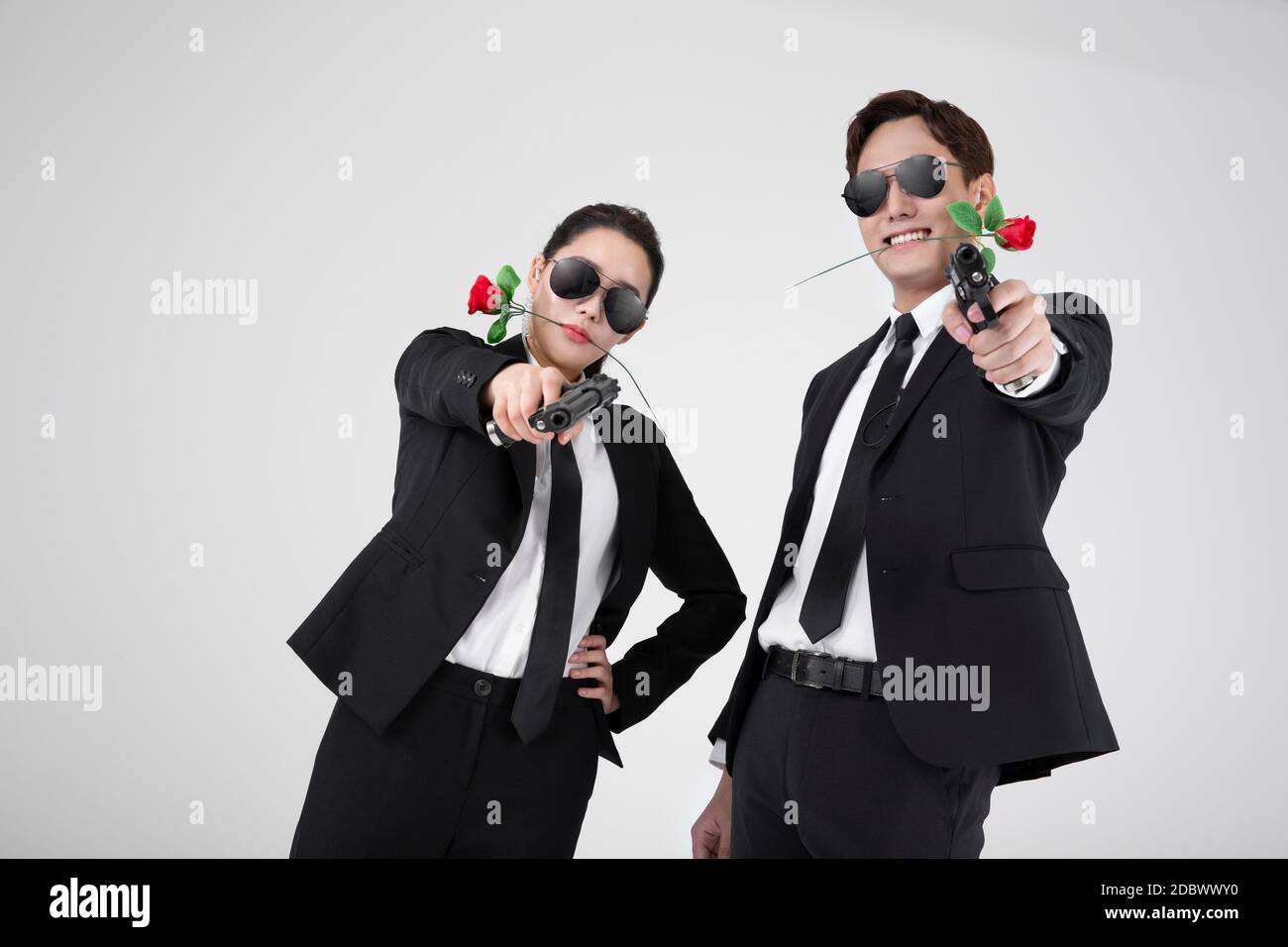 Asian male and female two security guards 093 Stock Photo - Alamy