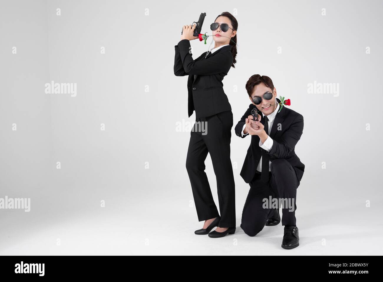 Asian male and female two security guards 094 Stock Photo - Alamy