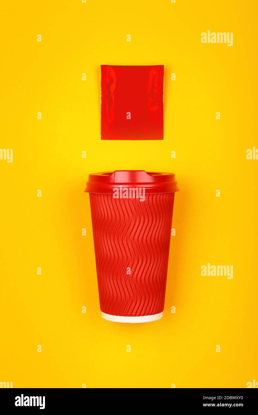 Close up one crimped disposable red paper takeaway cup and instant ...
