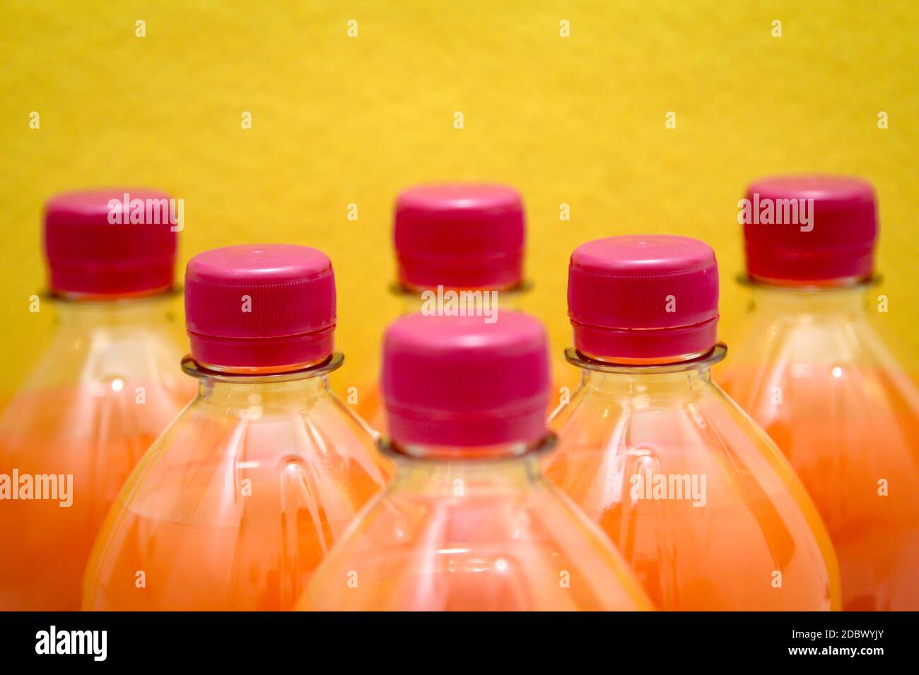 Beverage bottles with red lids, screw caps Stock Photo - Alamy