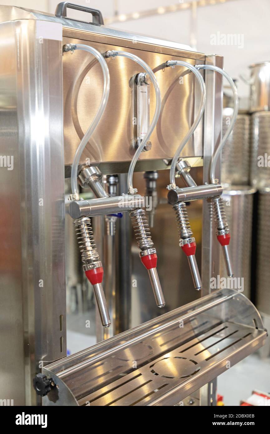 Bottle Filler Machine in Wine Production Line Stock Photo - Alamy