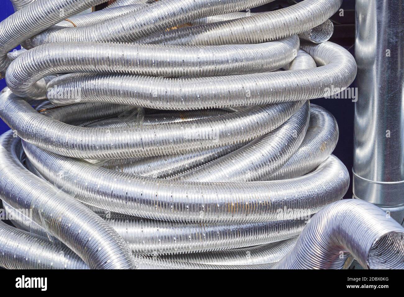 Big bunch of flexible aluminium hoses and pipes Stock Photo - Alamy