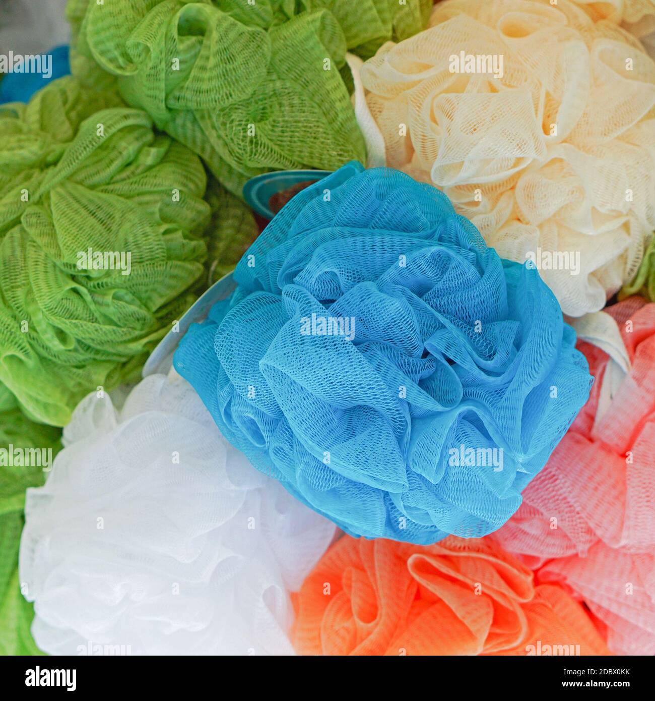 Mesh pouf bath sponge with exfoliating texture Stock Photo - Alamy