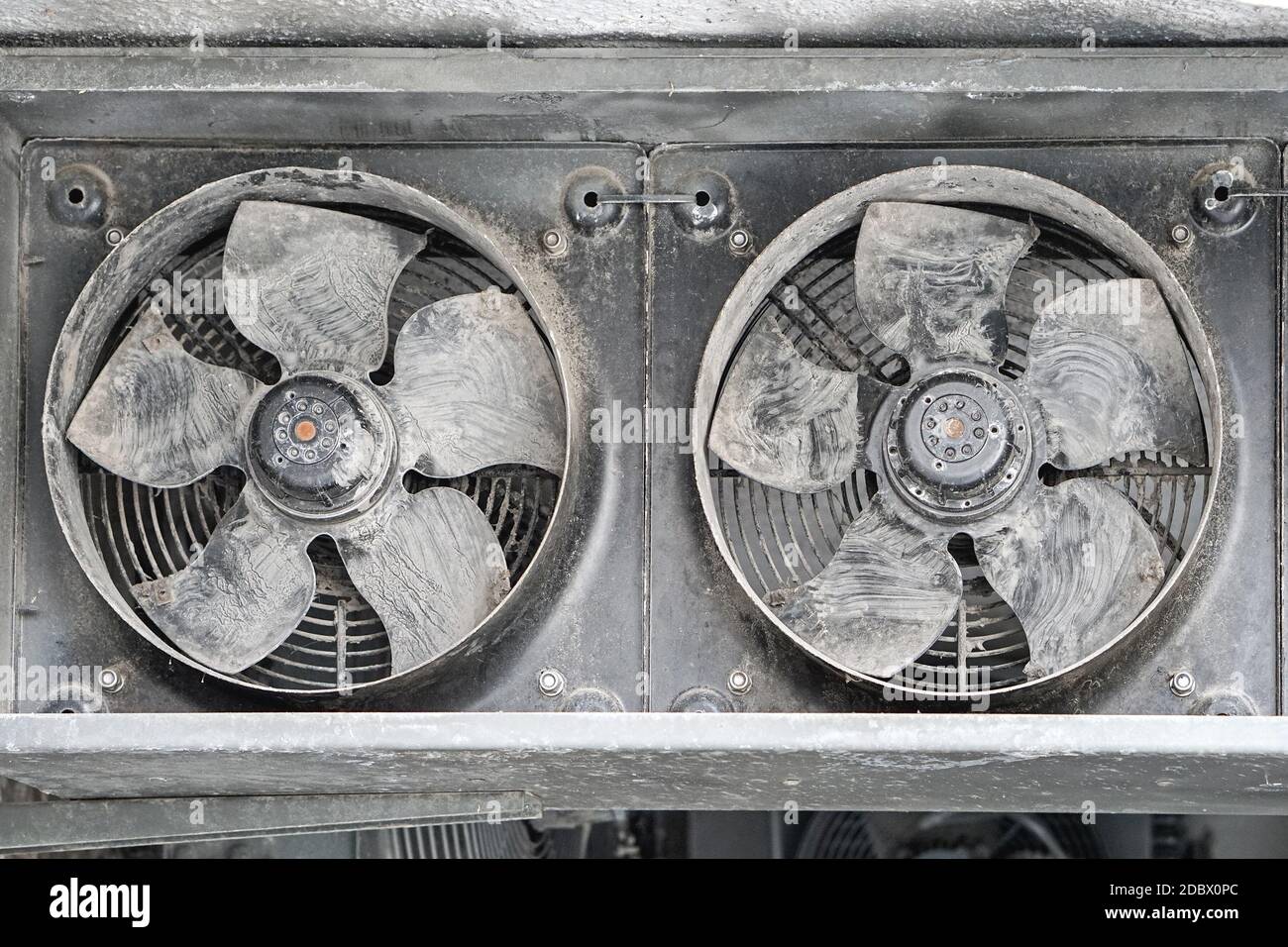 Two industrial cooling fans covered with dirt and dust Stock Photo - Alamy