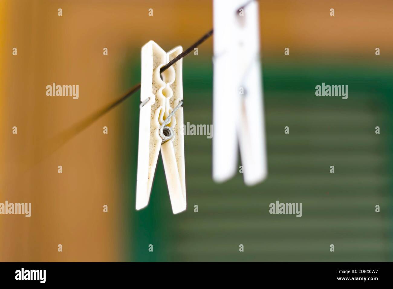 a white plastic clothespin hanging. housework and laundry Stock Photo ...