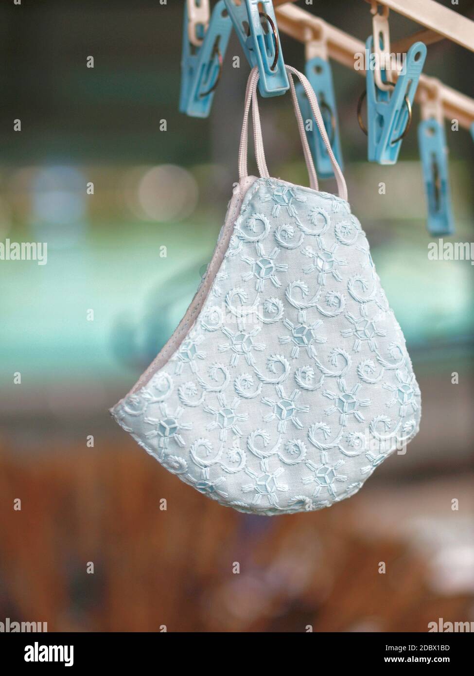 A hanged homemade cloth face mask made out of textile Stock Photo - Alamy