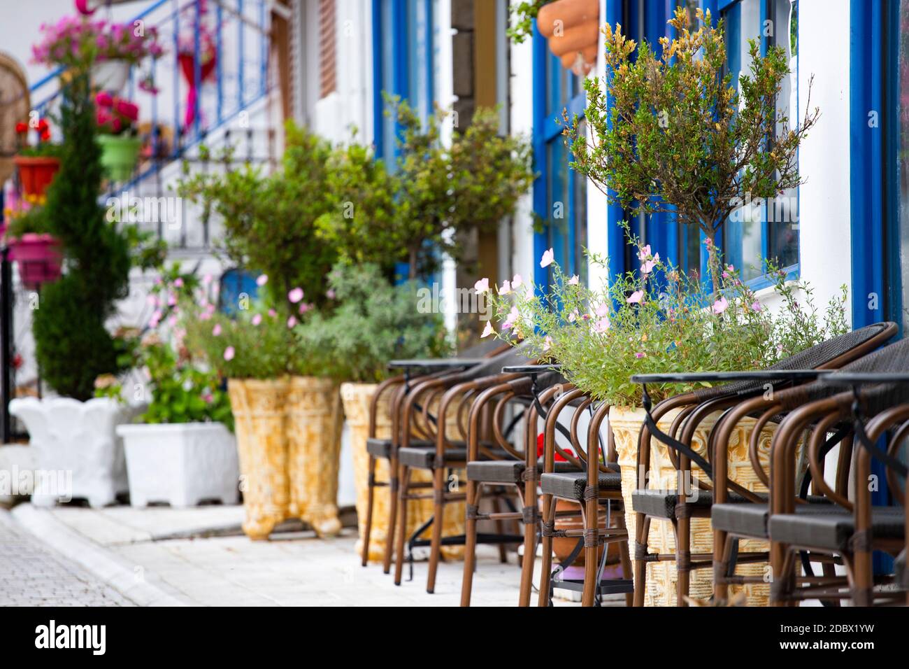 Mediterranean restaurant terrace exterior with chairs. Holiday travel ...