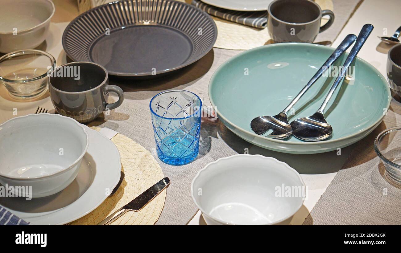 Ceramic dishes and bowls at modern dining table top Stock Photo - Alamy