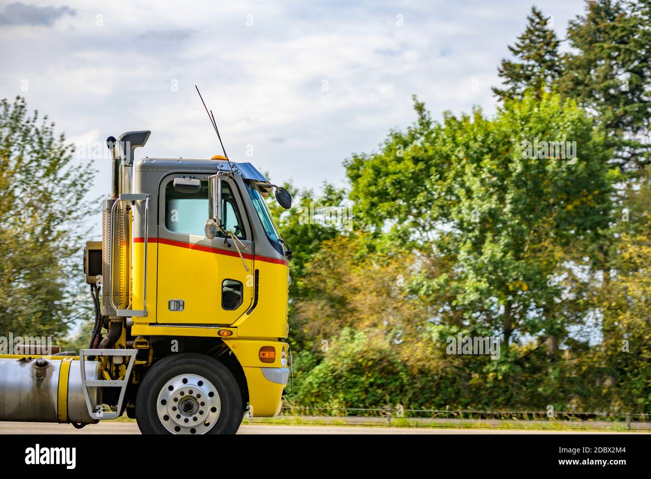 Compact powerful cab over engine big rig yellow semi truck tractor ...