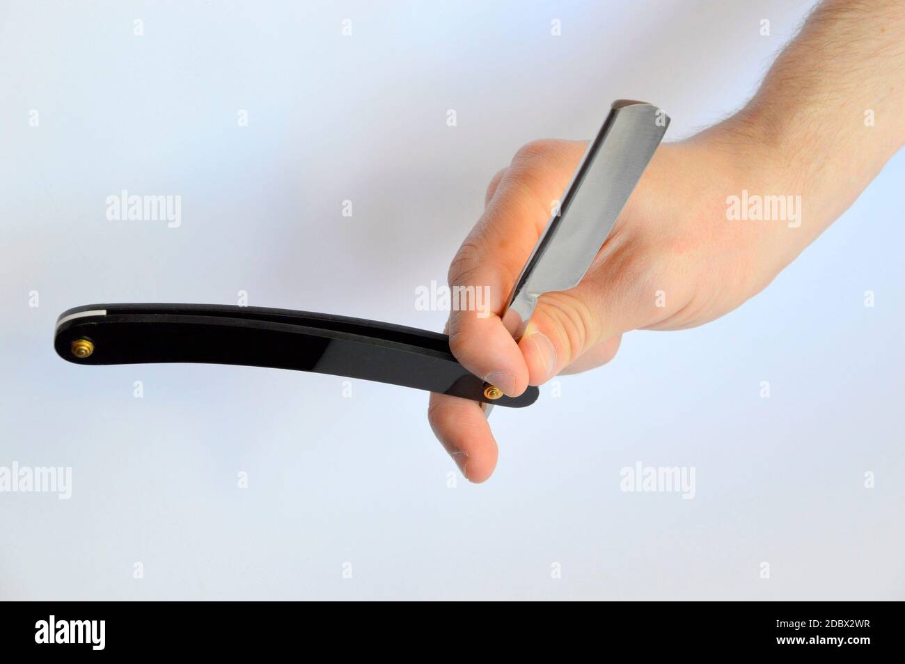 Hand holding sharp razor blade hi-res stock photography and images - Alamy