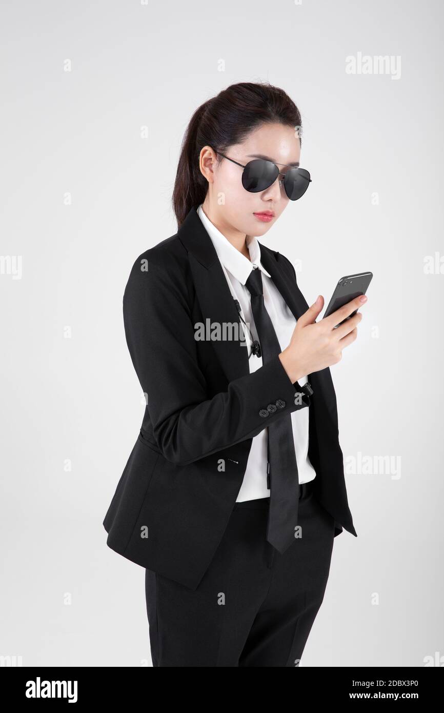 Asian male and female two security guards 120 Stock Photo - Alamy