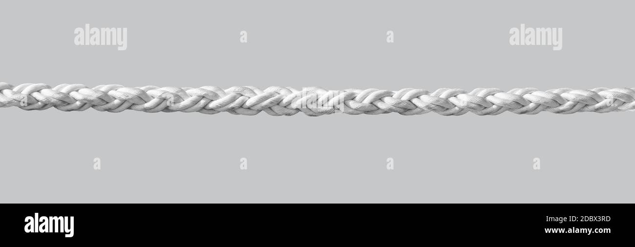 White braided rope on an isolated gray background Stock Photo - Alamy
